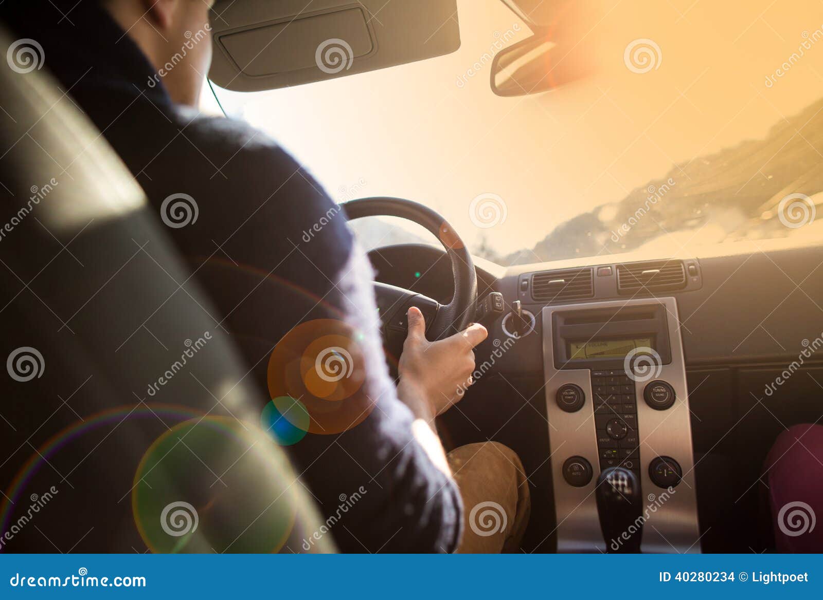 Young Man Driving His Car in a Strong Sunlight Stock Photo - Image of ...