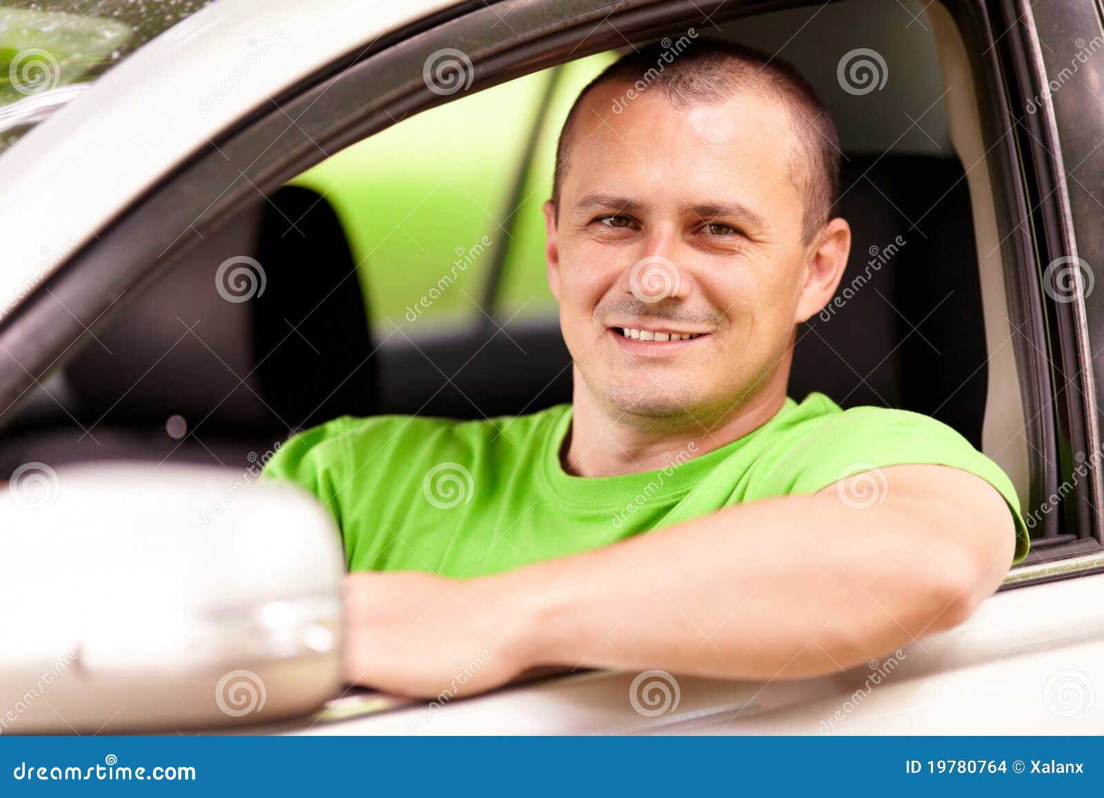Young man driving new car stock photo. Image of hand - 19780764