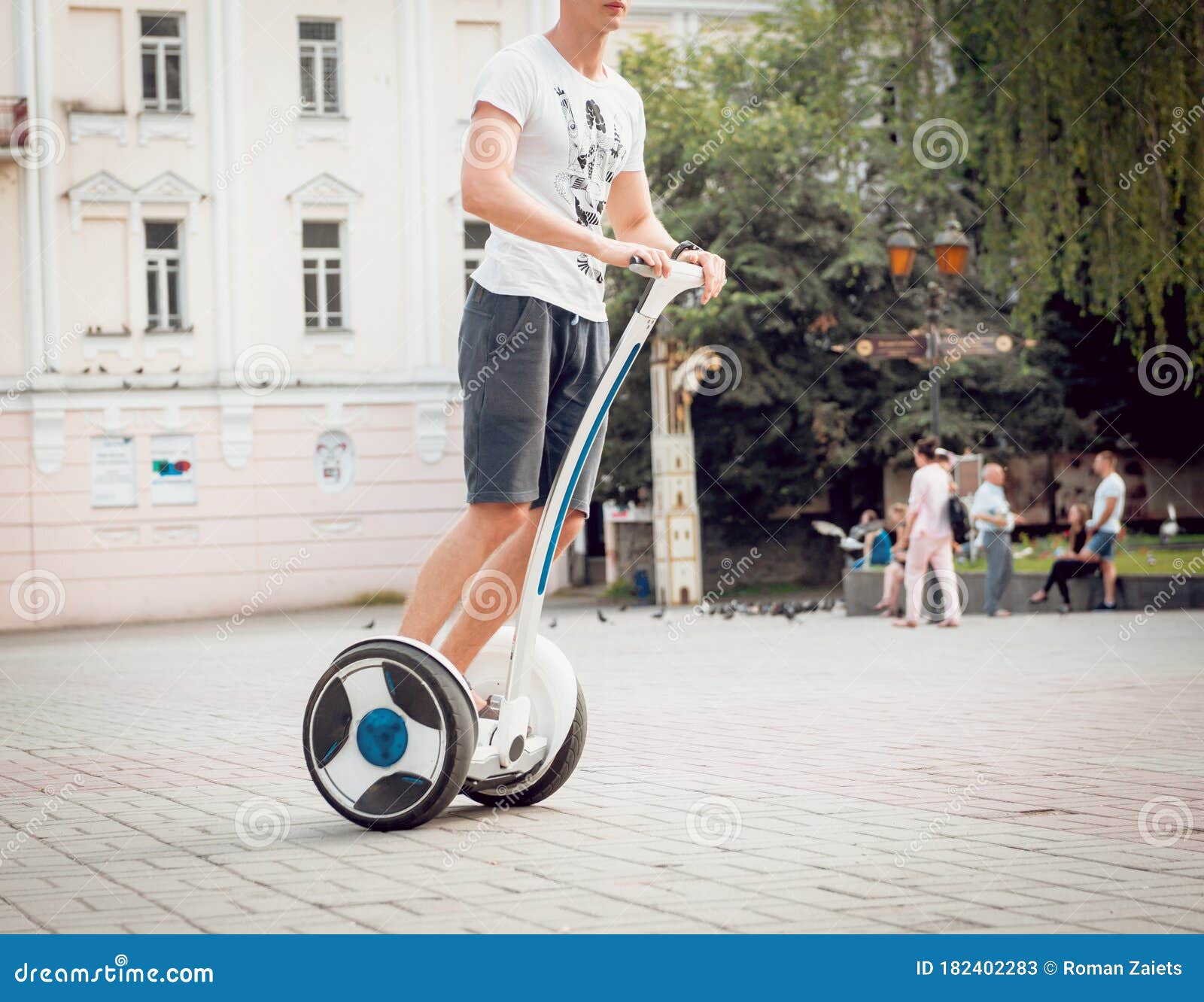Young Man Driving on Segway in the Park. Stock Image - Image of segway ...