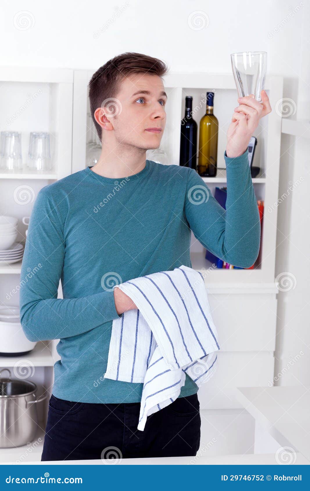 Man Drying and Polishing Glass with a Kitchen Towel Stock Photo - Image ...