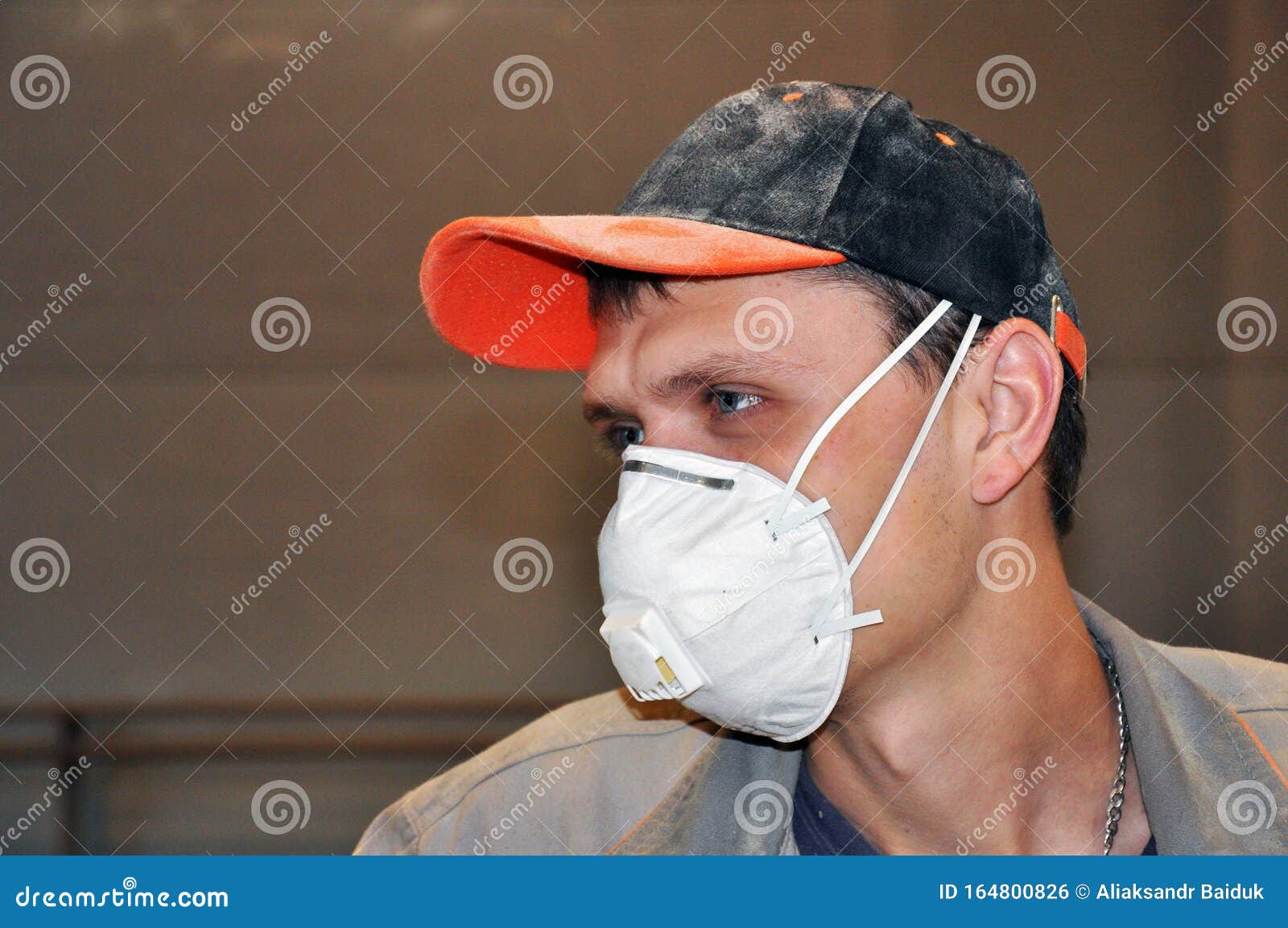 Young Man in a Dust Mask and Dusty Cap at Work Stock Photo - Image of ...