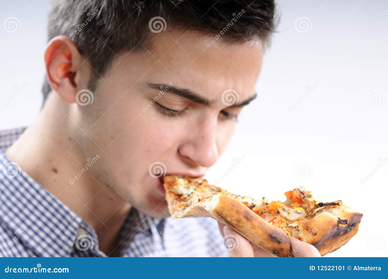 Young man eating stock image. Image of slice, help, meal - 12522101