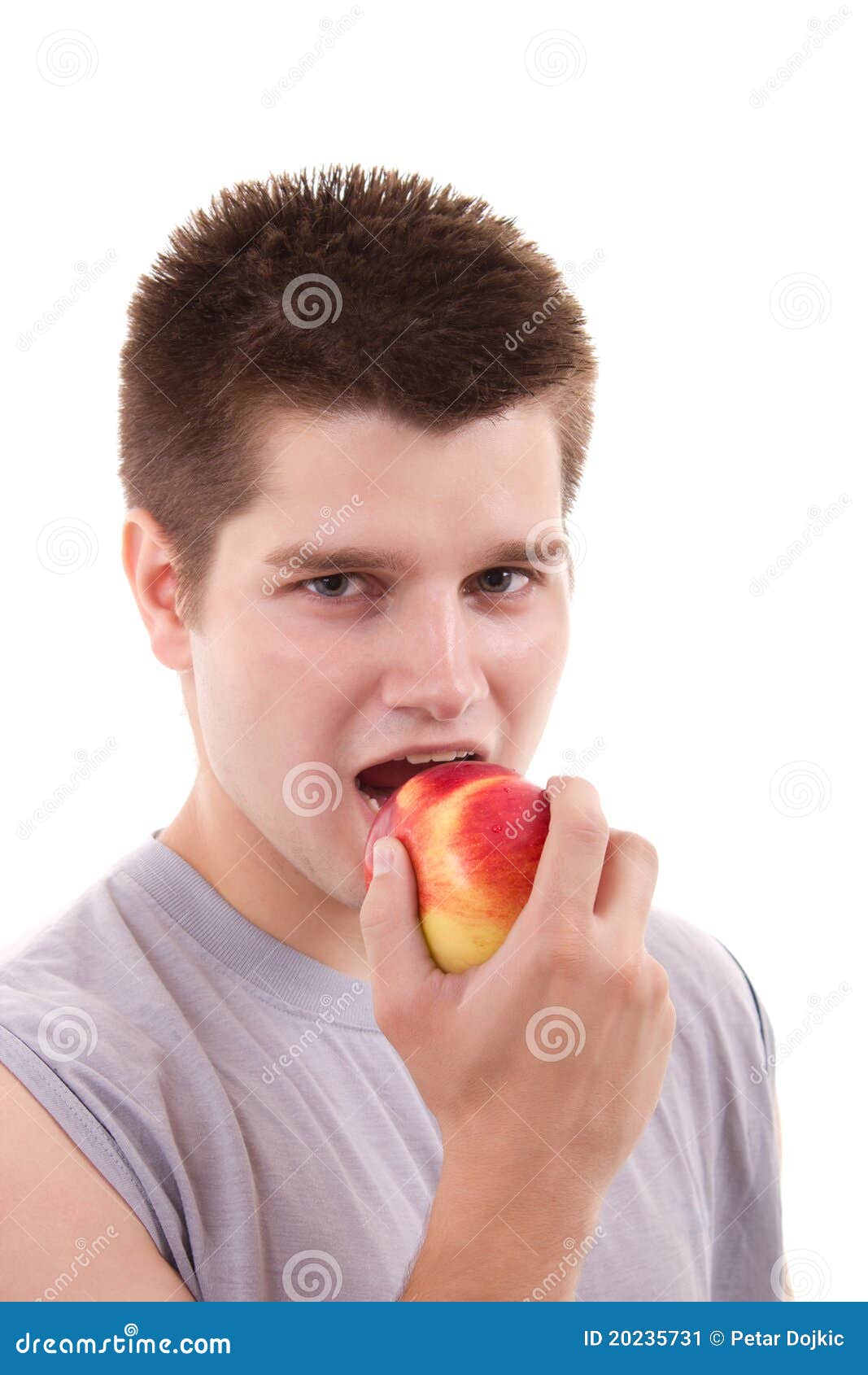 Young man eating apple stock image. Image of snack, fresh - 20235731