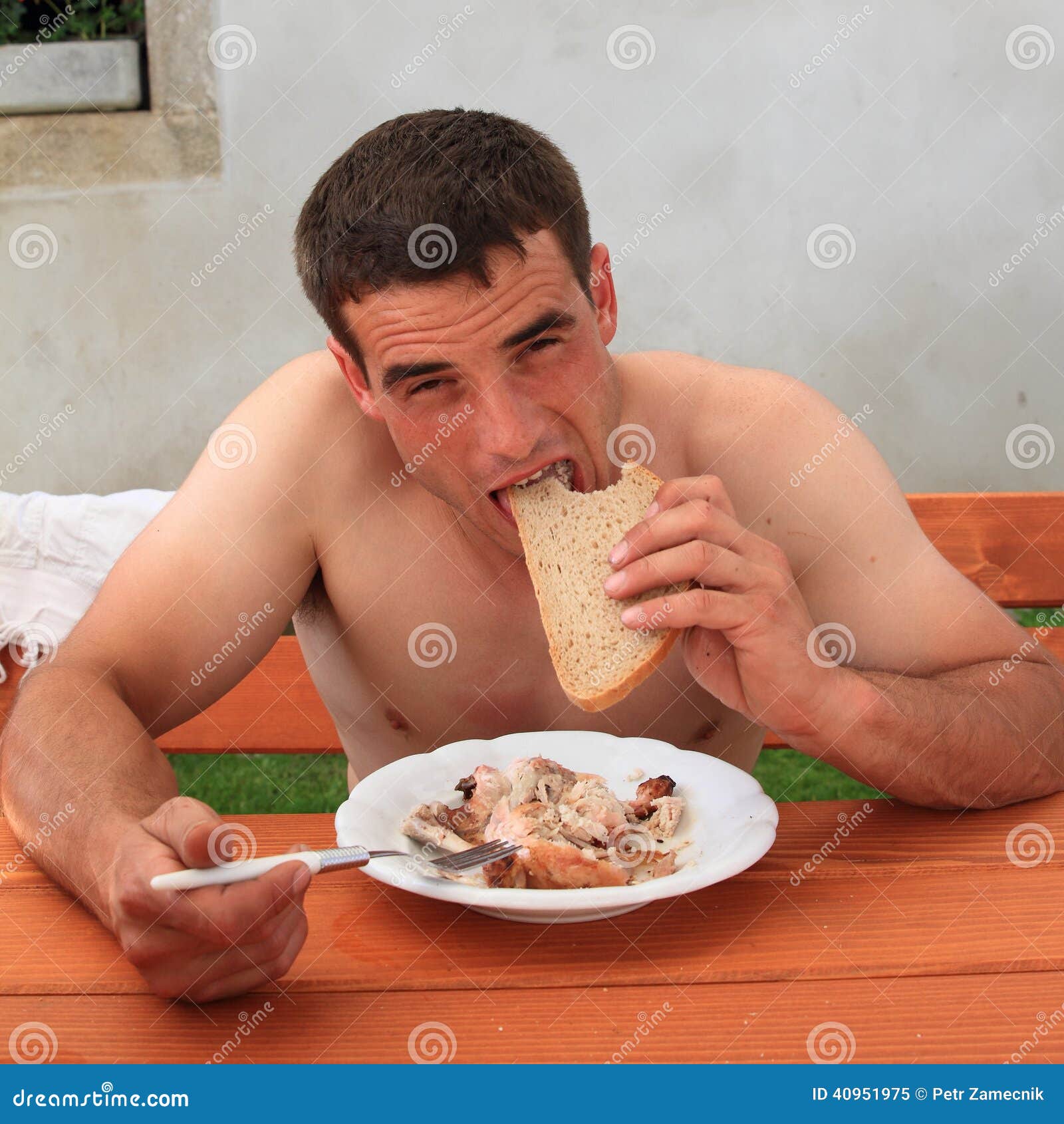 Young Man Eating Bread Stock Image | CartoonDealer.com #40951975