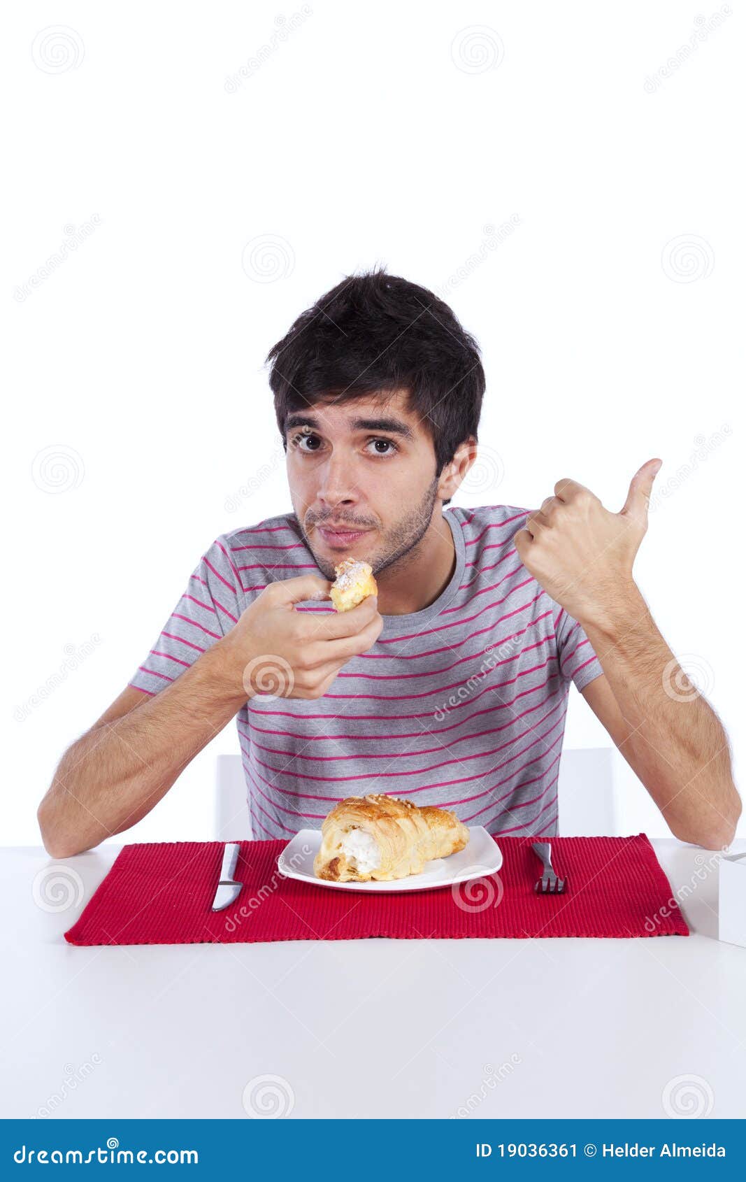 Young man eating a cake stock image. Image of lifestyle - 19036361