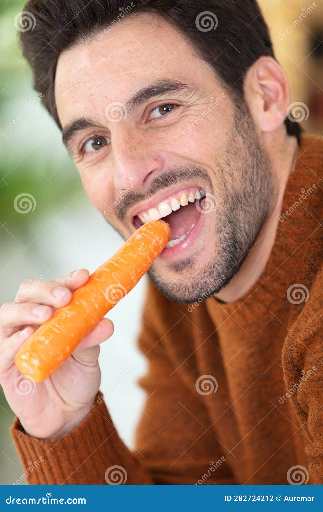 Young man eating carrot stock photo. Image of food, healthy - 282724212