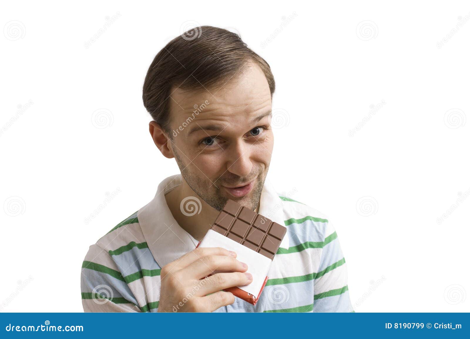 Young man eating chocolate stock image. Image of mouth - 8190799