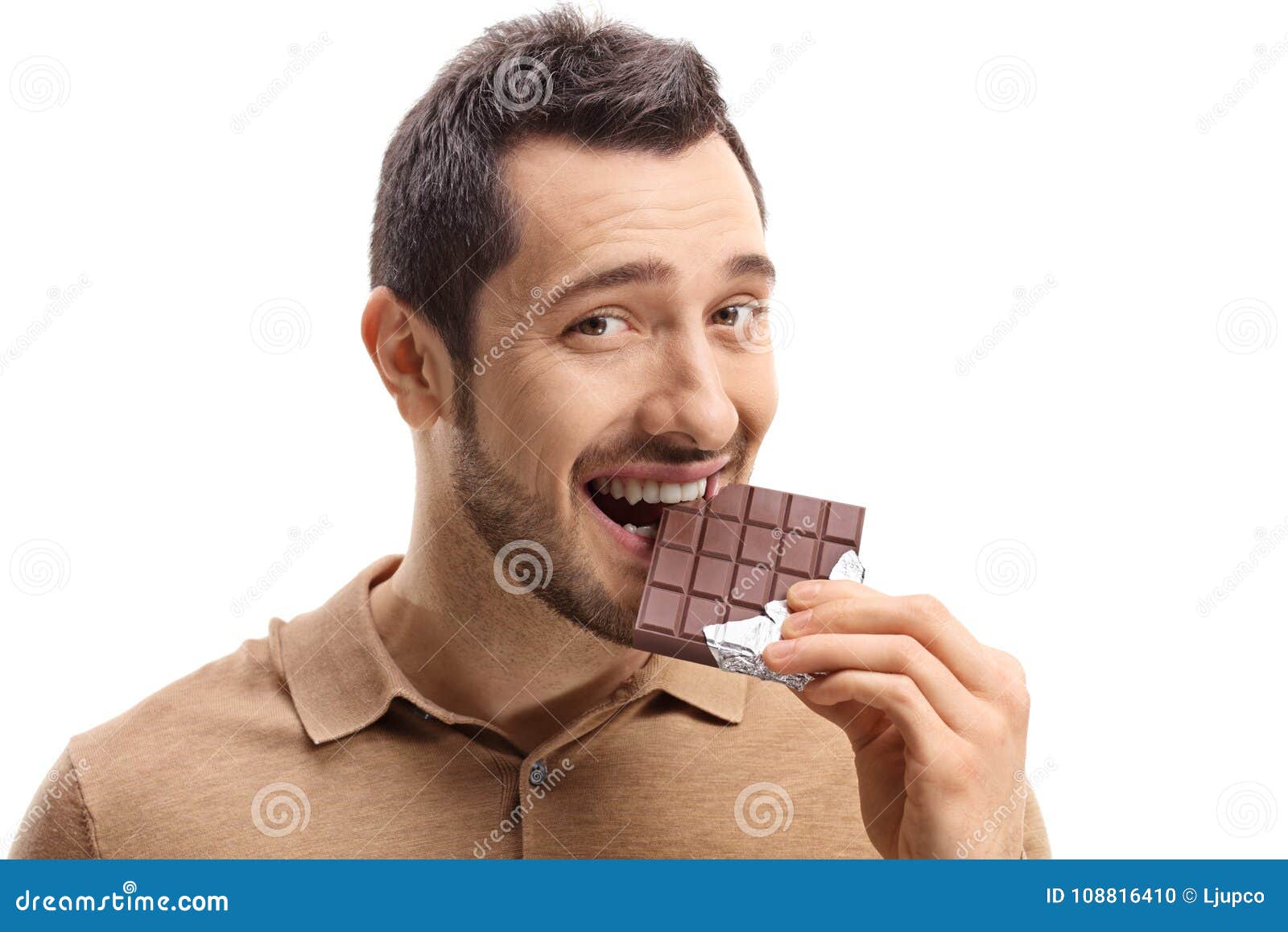 Young man eating chocolate stock photo. Image of caucasian - 108816410