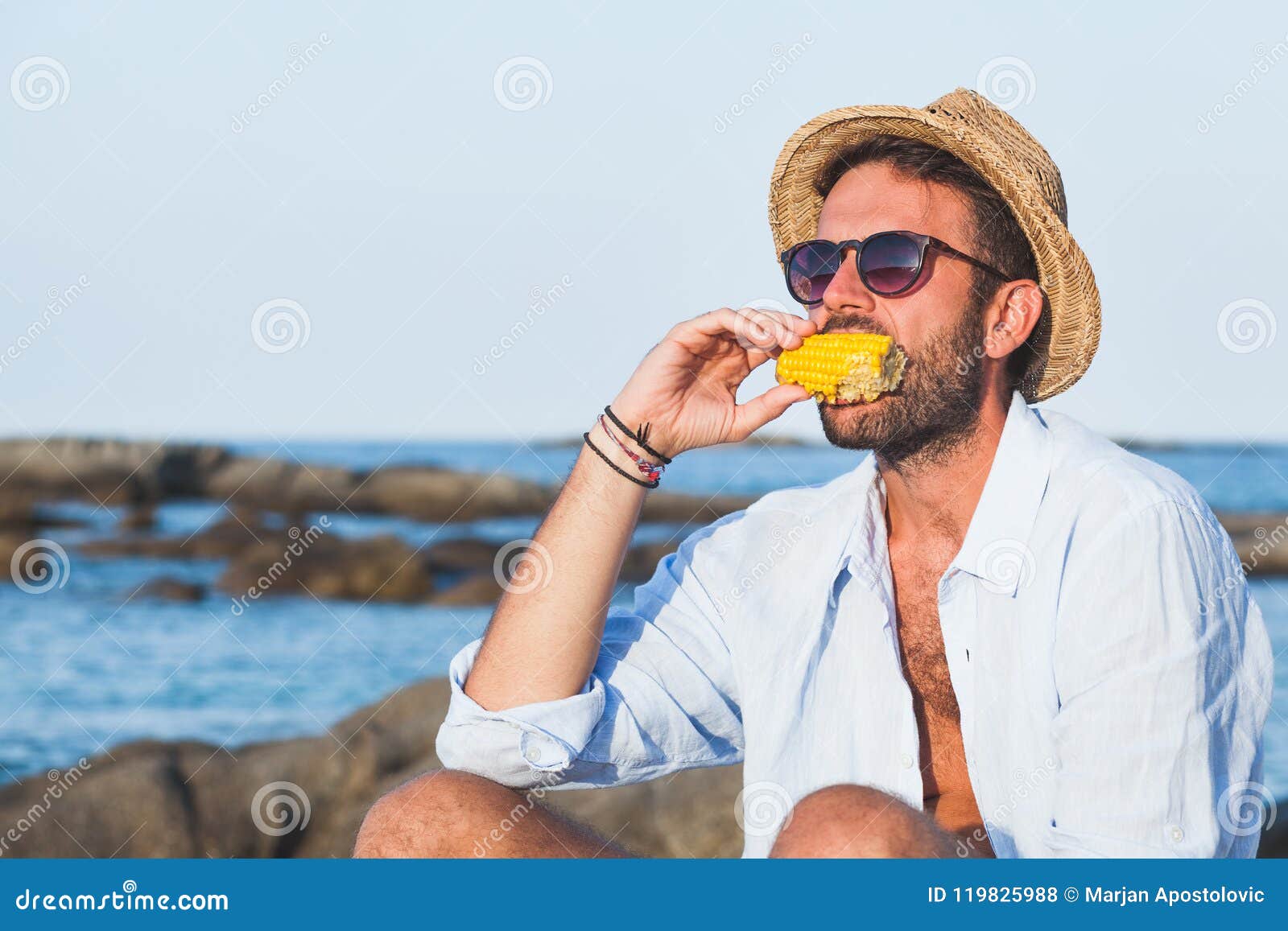Young Man Eating Corn on the Beach Stock Photo - Image of health ...