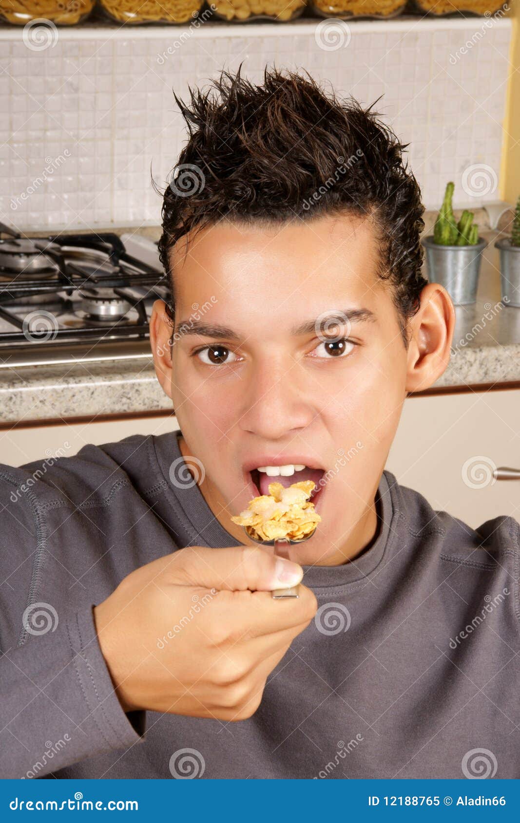 Young Man Eating Cornflakes Stock Image - Image of meal, studio: 12188765
