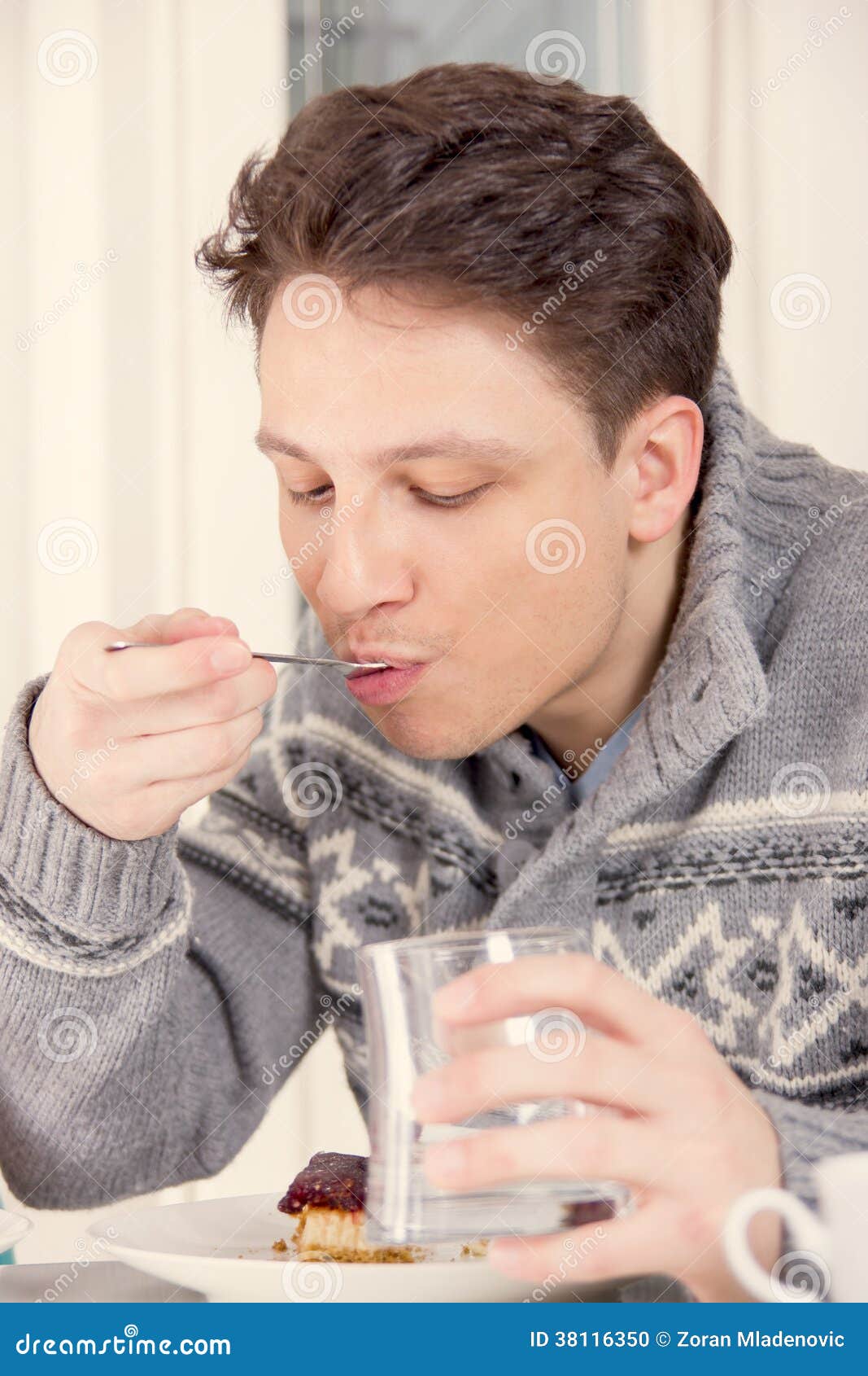 Young man eating a dessert stock photo. Image of dessert - 38116350