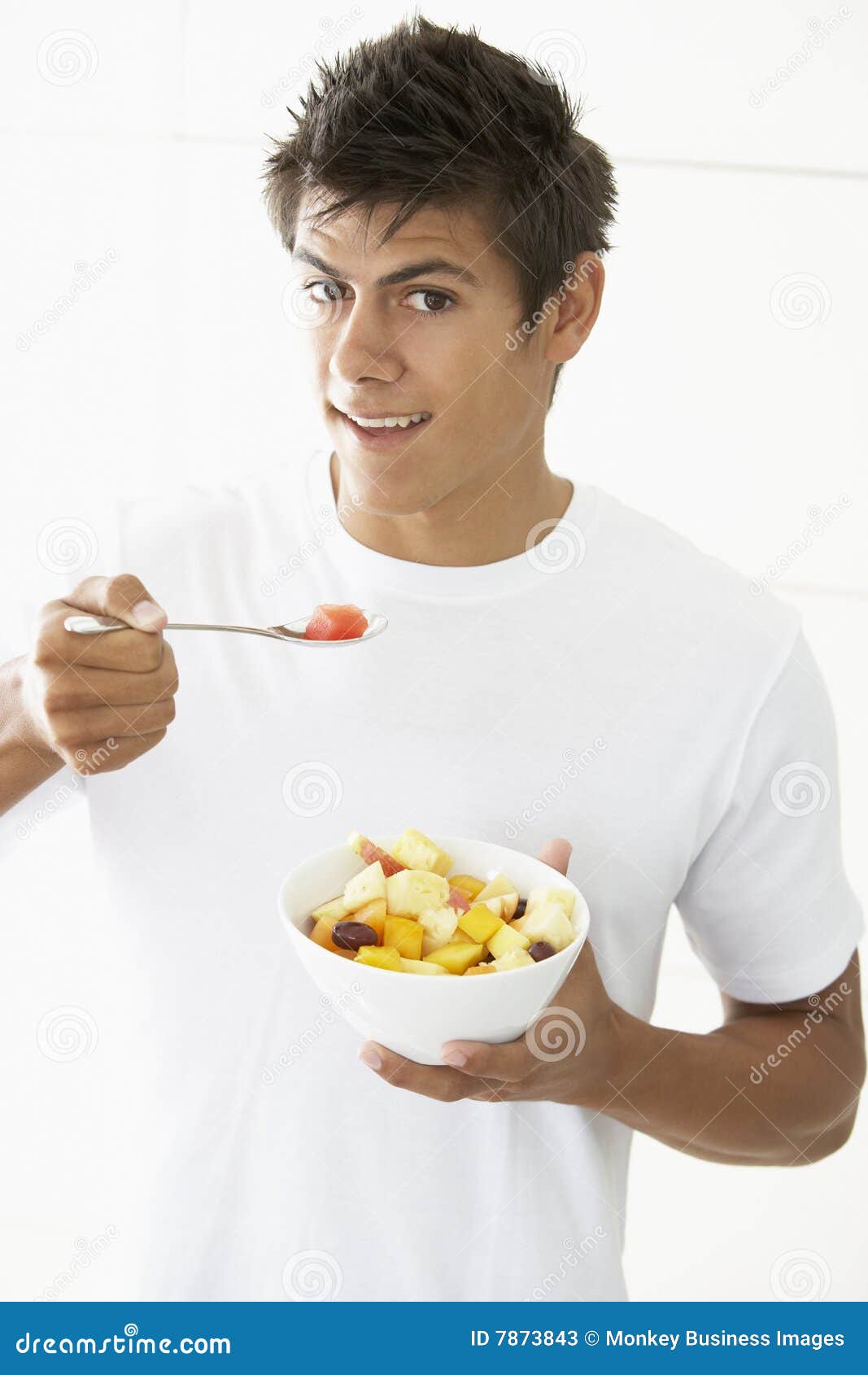 Young Man Eating Fresh Fruit Salad Stock Image - Image of beautiful ...