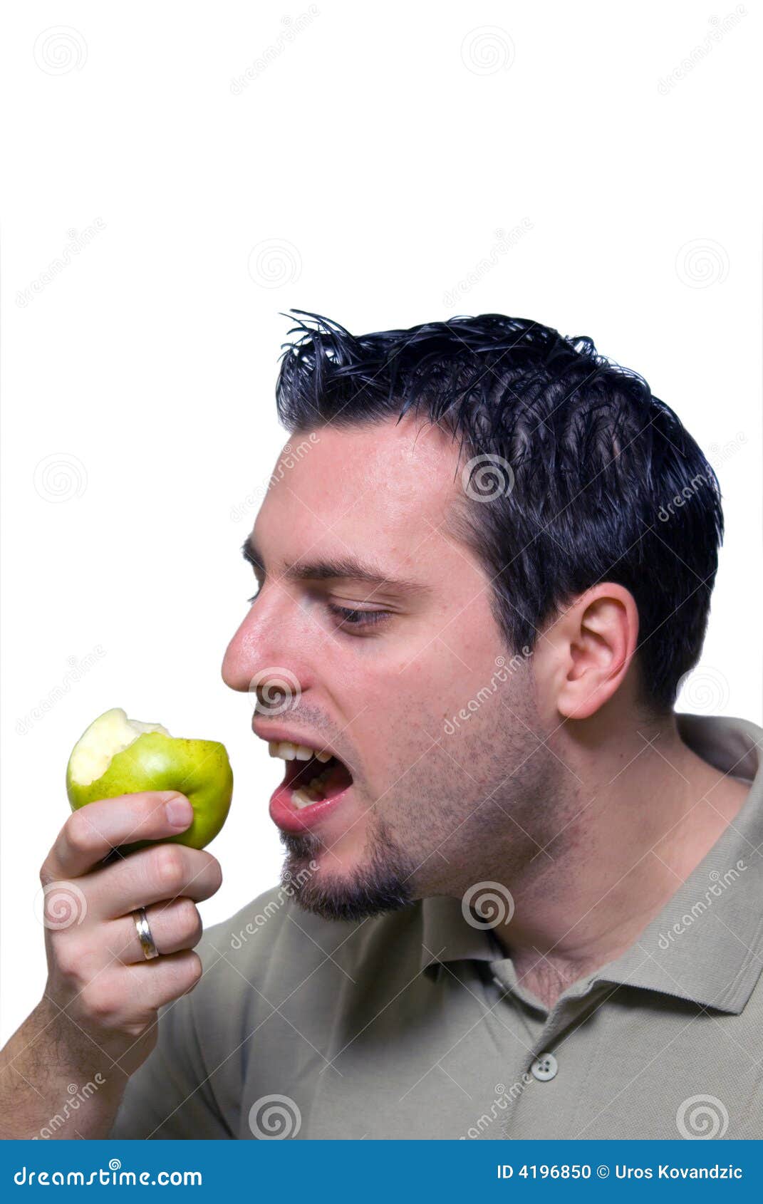 Young Man Eating a Green Apple Stock Photo - Image of food, teeth: 4196850