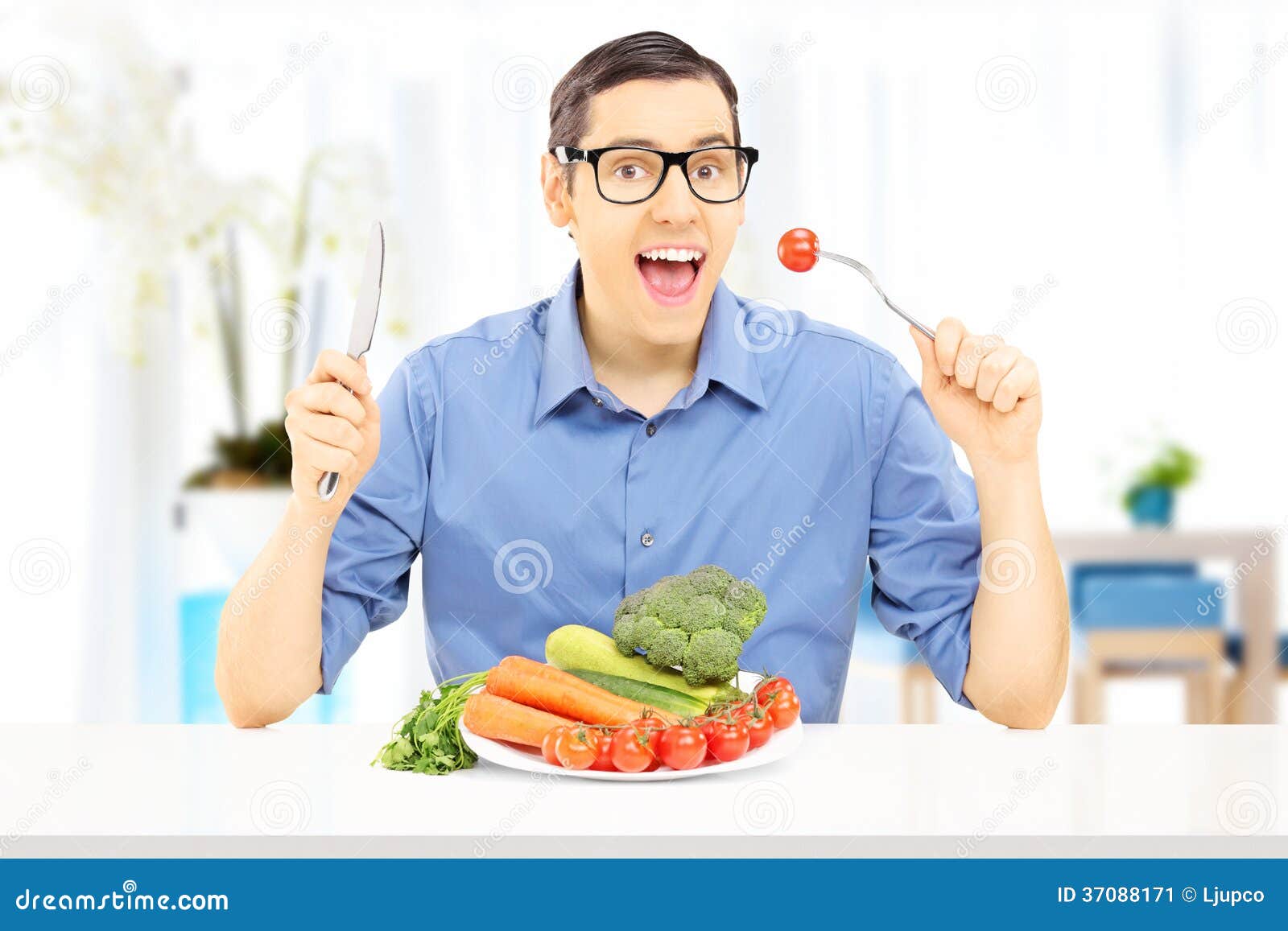 Young Man Eating a Healthy Meal at Home Stock Image - Image of dish ...