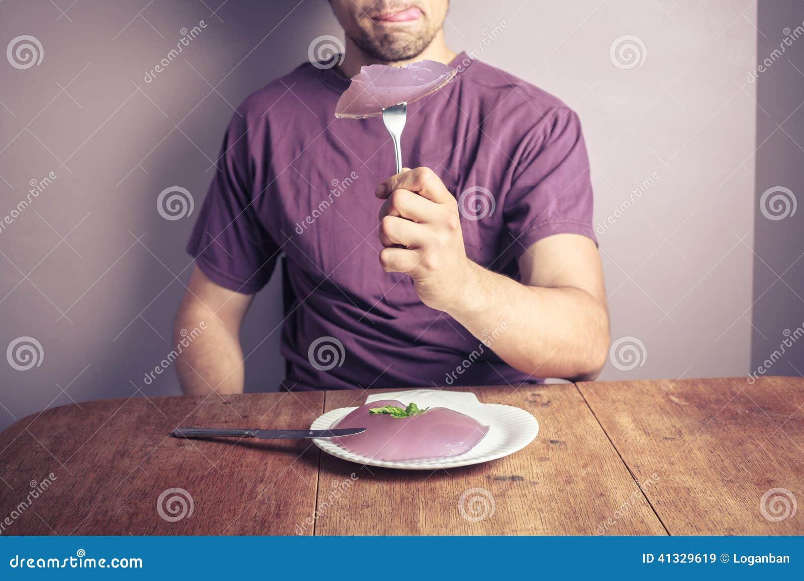 Young Man Eating Purple Pudding Stock Image - Image of fruit, delicious ...