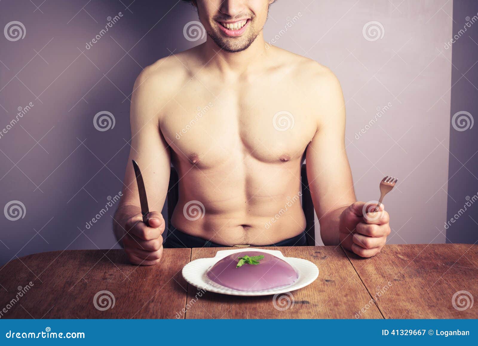 Young Man Eating Purple Pudding Stock Image - Image of enjoying ...