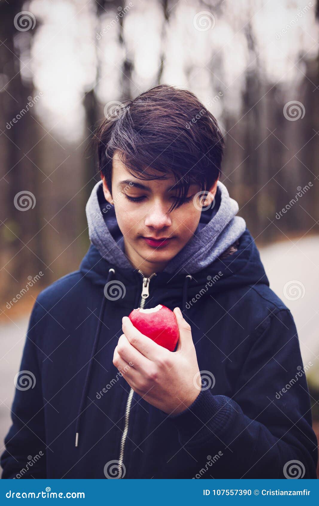 Young Man Eating a Red Apple Stock Photo - Image of apple, organic ...
