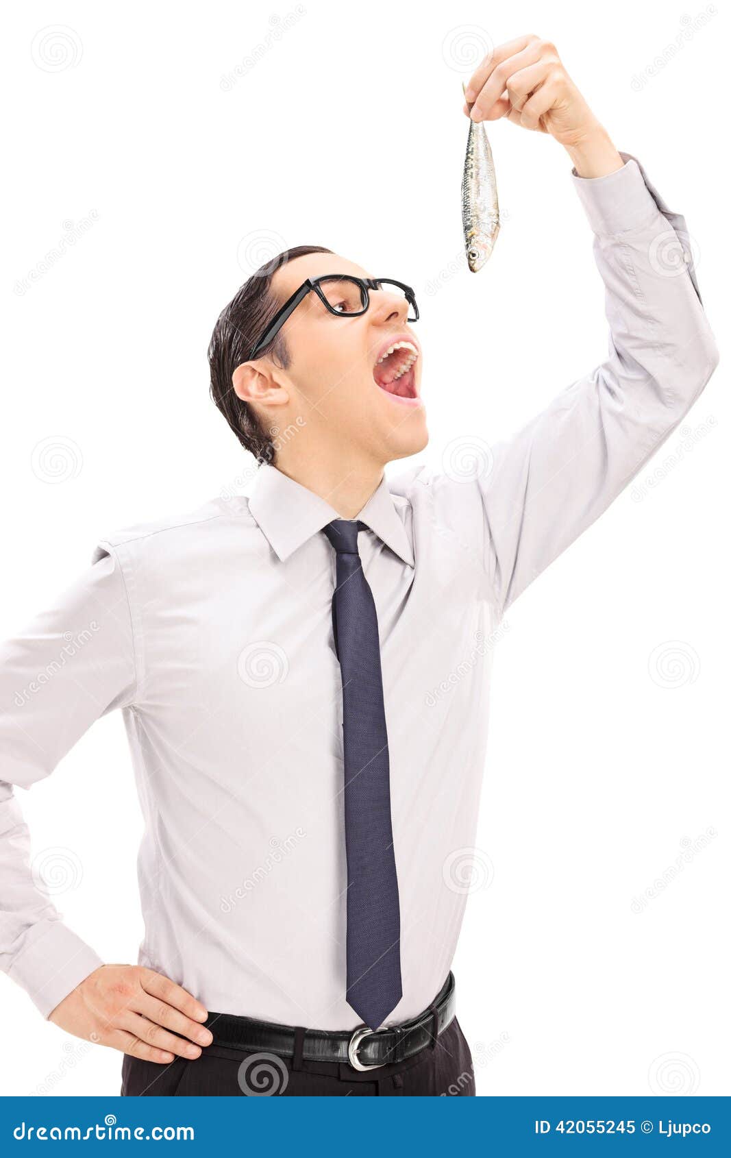Young Man Eating a Small Fish Stock Image - Image of posing, isolated ...