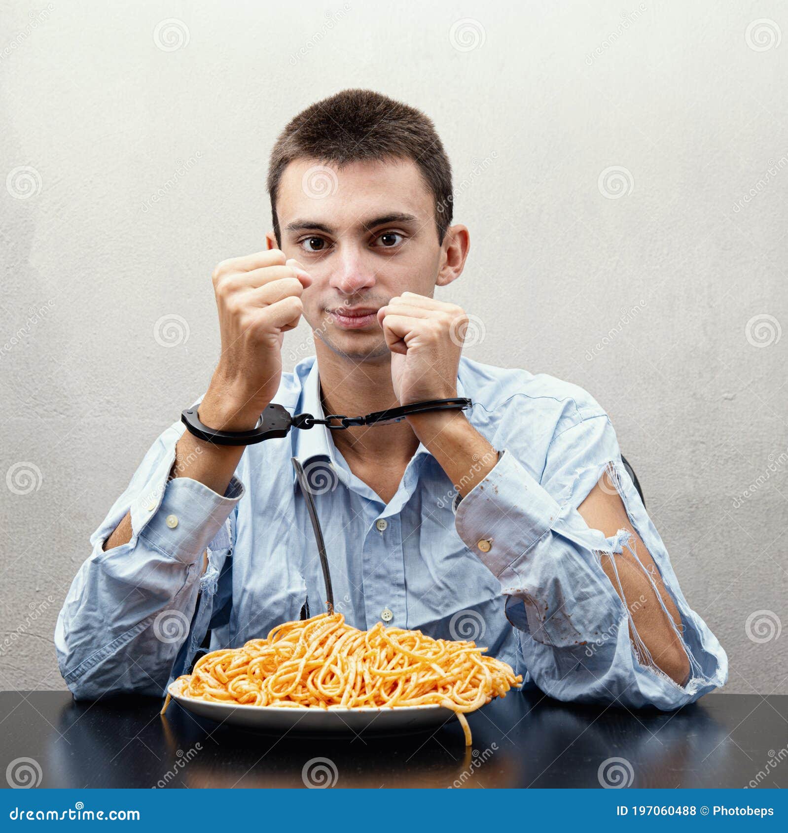 Young Man Eating Spaghetti Handcuffed Stock Photo - Image of greasy ...