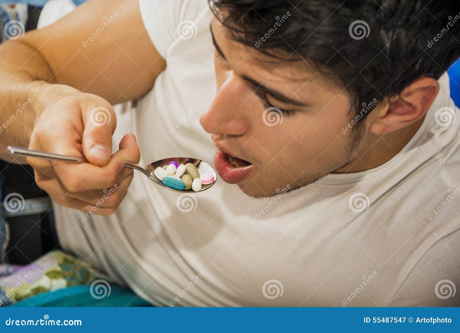 Young Man Eating a Spoon Full of Medicine Stock Image - Image of ...