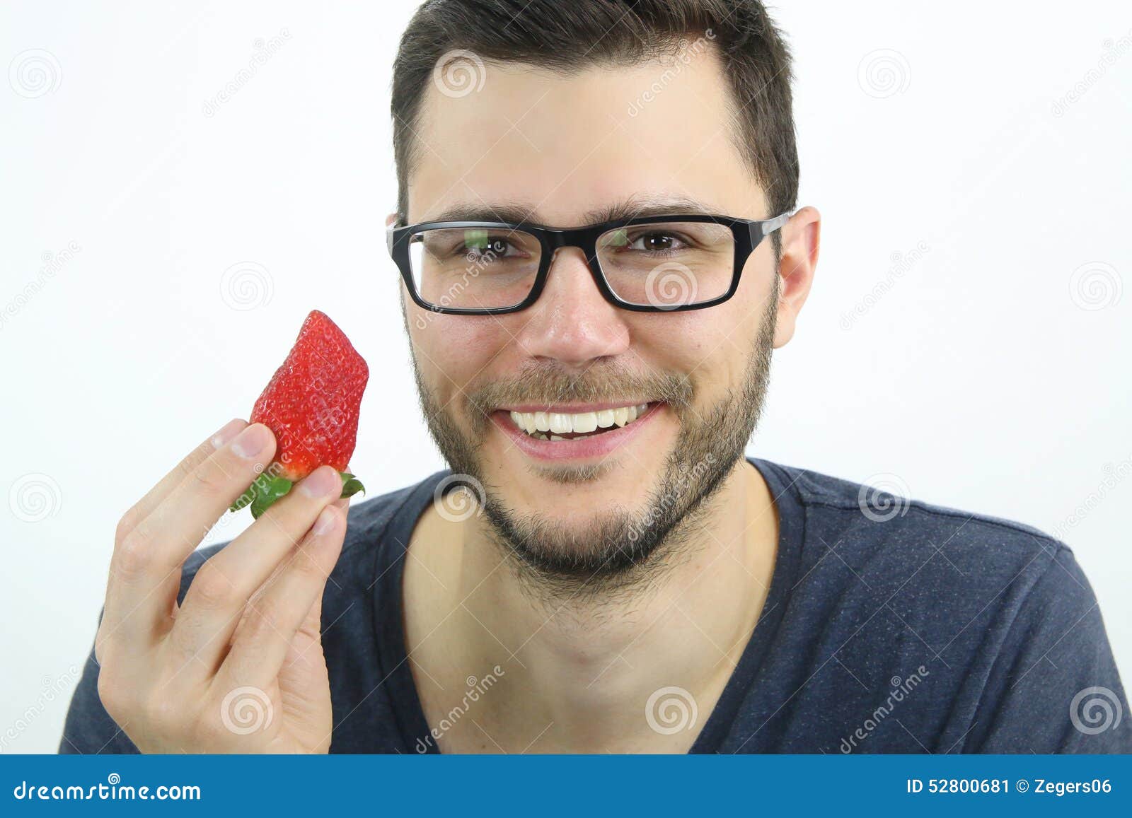 Young Man Eating a Strawberry Stock Image - Image of fresh, dental ...