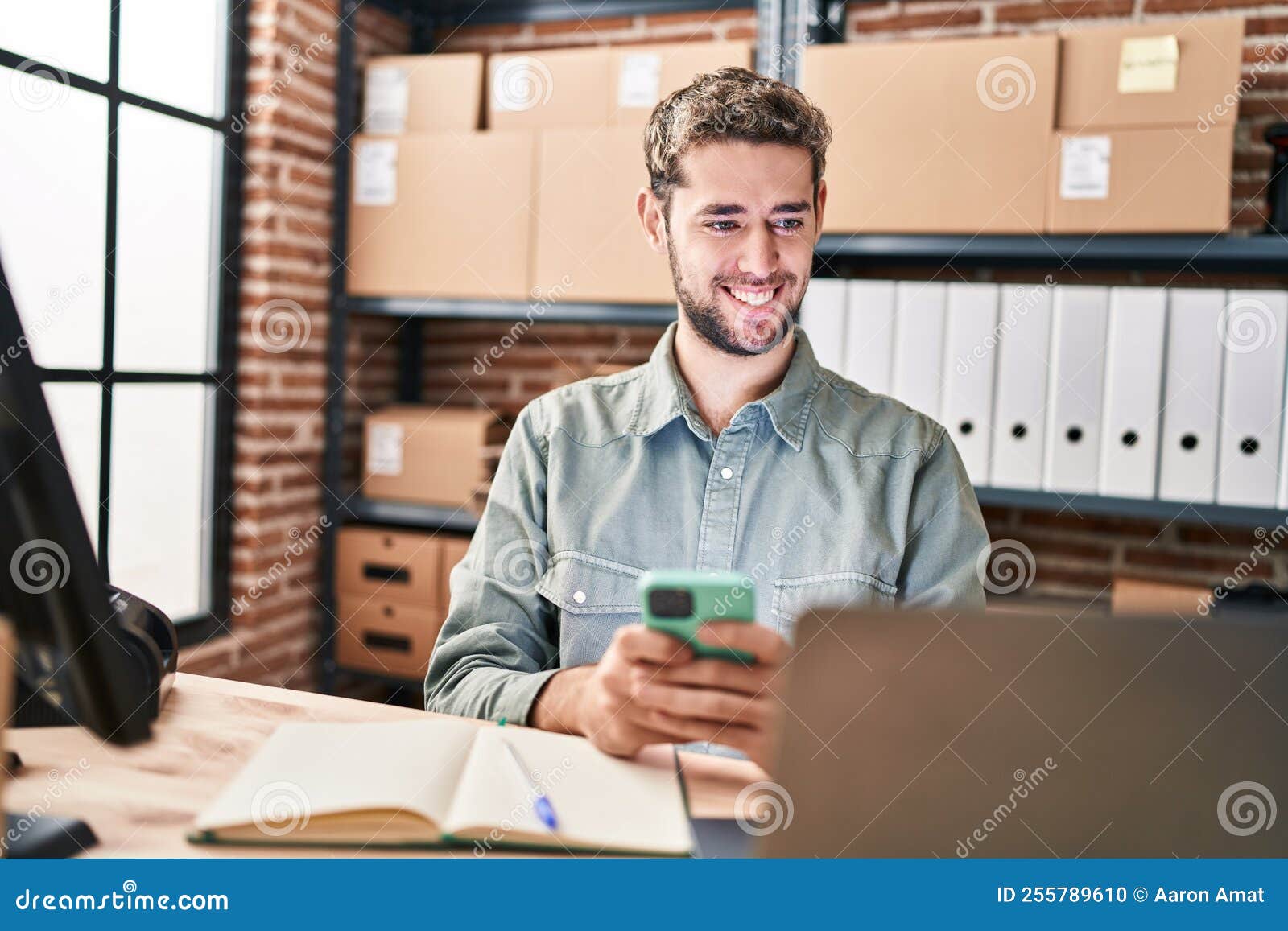 Young Man Ecommerce Business Worker Using Laptop and Smartphone at ...