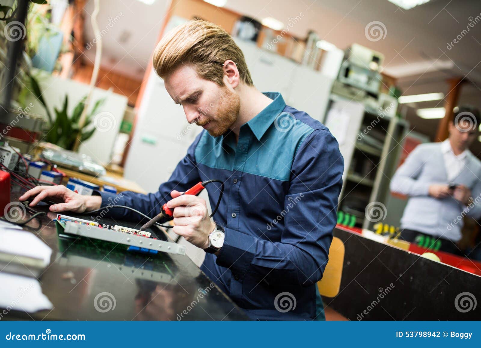 Young Man in Electronics Workshop Stock Photo - Image of technology ...