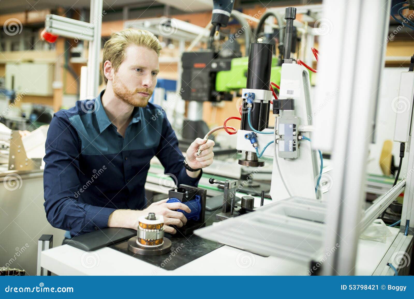 Young Man in Electronics Workshop Stock Image - Image of equipment ...