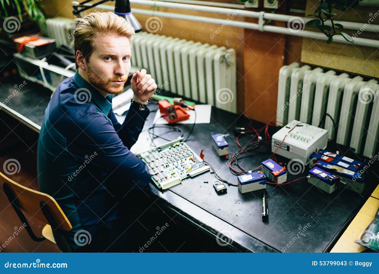 Young Man in Electronics Workshop Stock Image - Image of industry ...