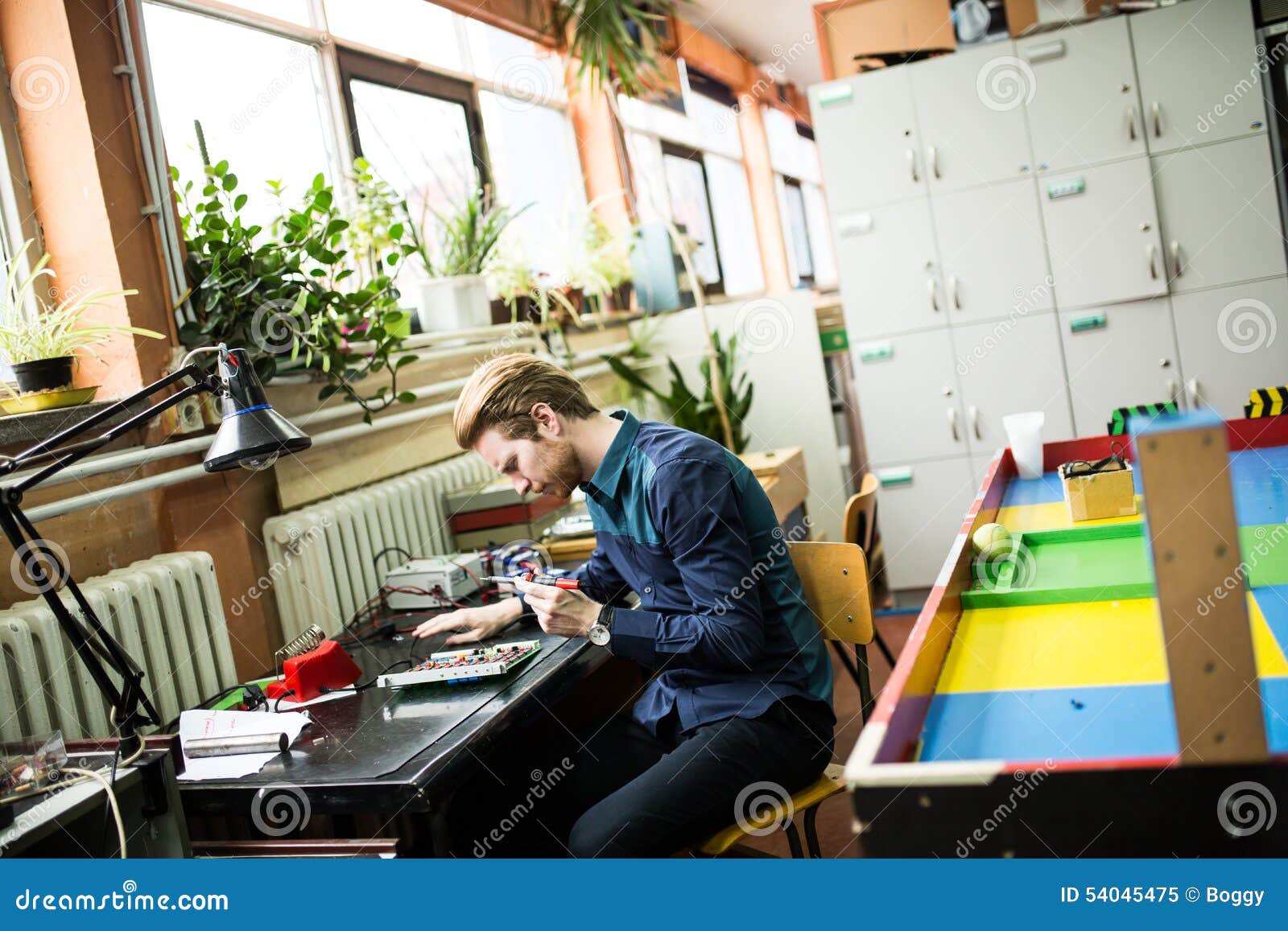 Young Man in Electronics Workshop Stock Image - Image of technology ...