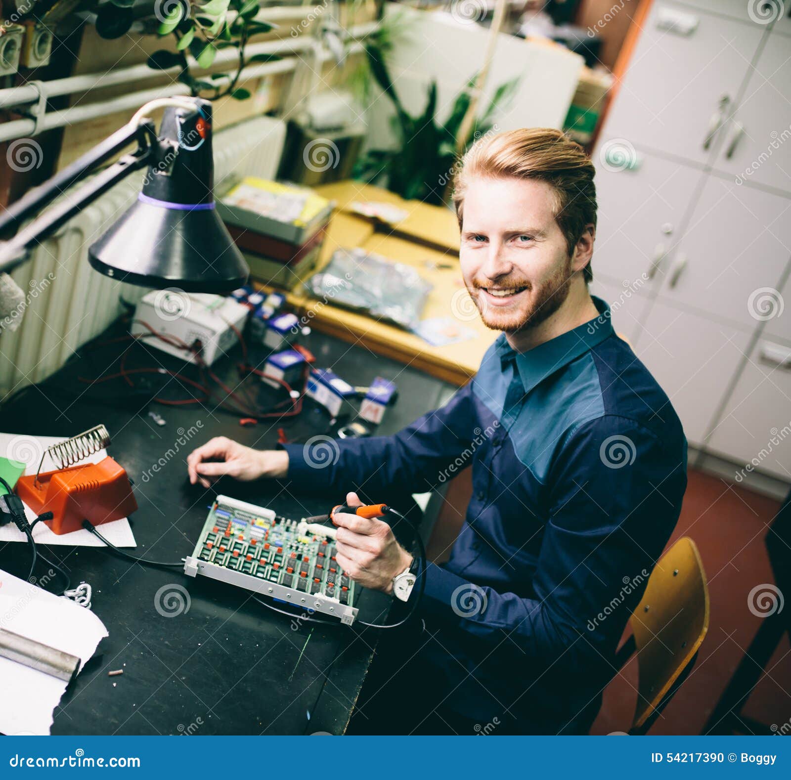Young Man in Electronics Workshop Stock Photo - Image of electricity ...