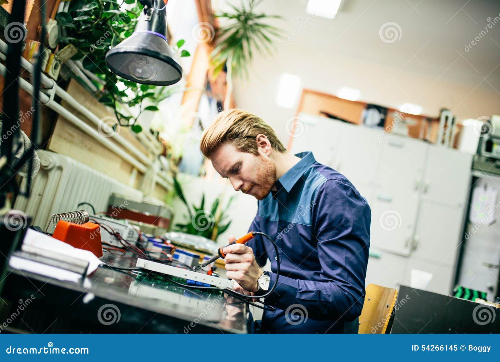 Young Man in Electronics Workshop Stock Image - Image of worker ...
