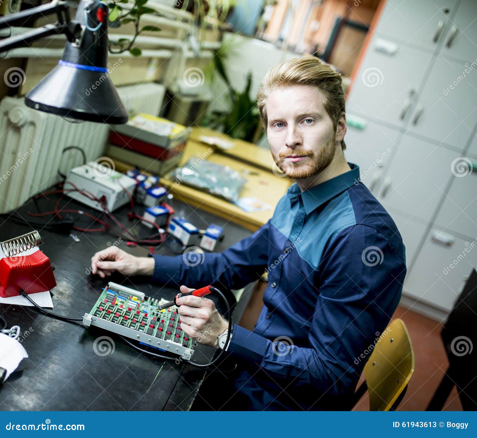 Young Man in Electronics Workshop Stock Image - Image of technician ...