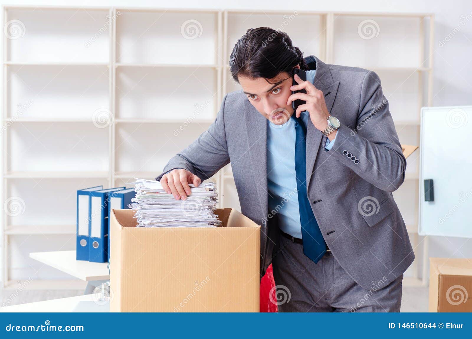 The Young Man Employee with Boxes in the Office Stock Photo - Image of ...