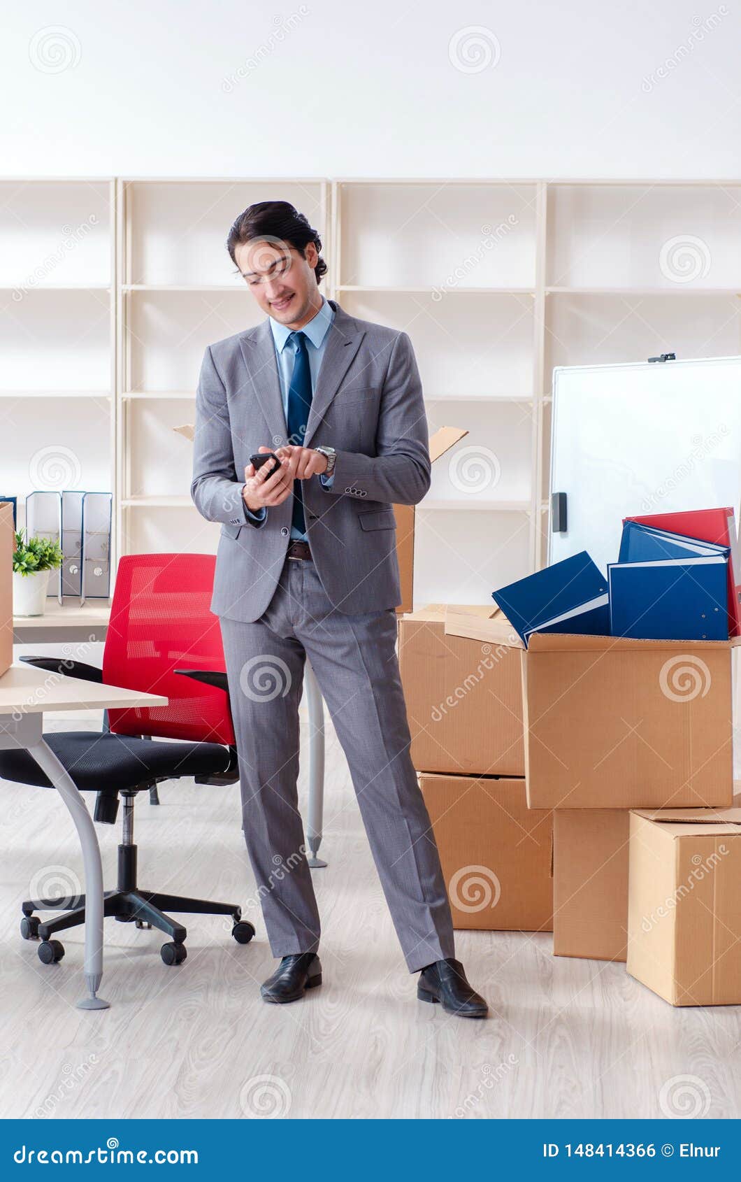 The Young Man Employee with Boxes in the Office Stock Photo - Image of ...
