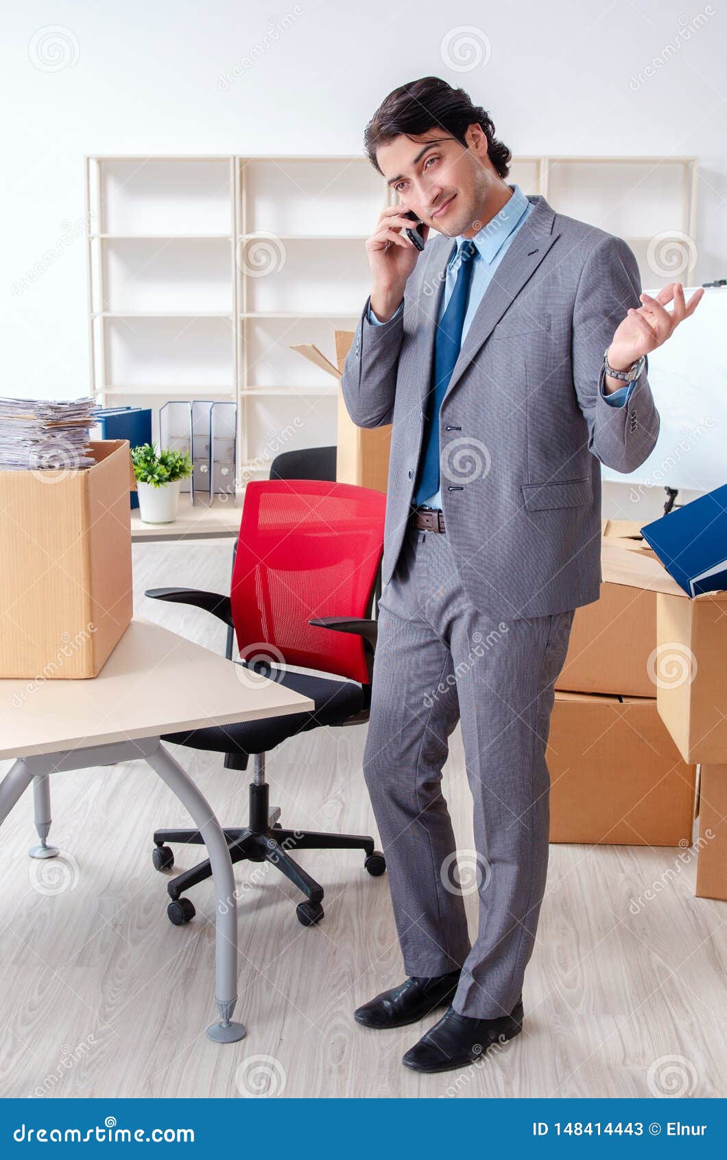 The Young Man Employee with Boxes in the Office Stock Image - Image of ...