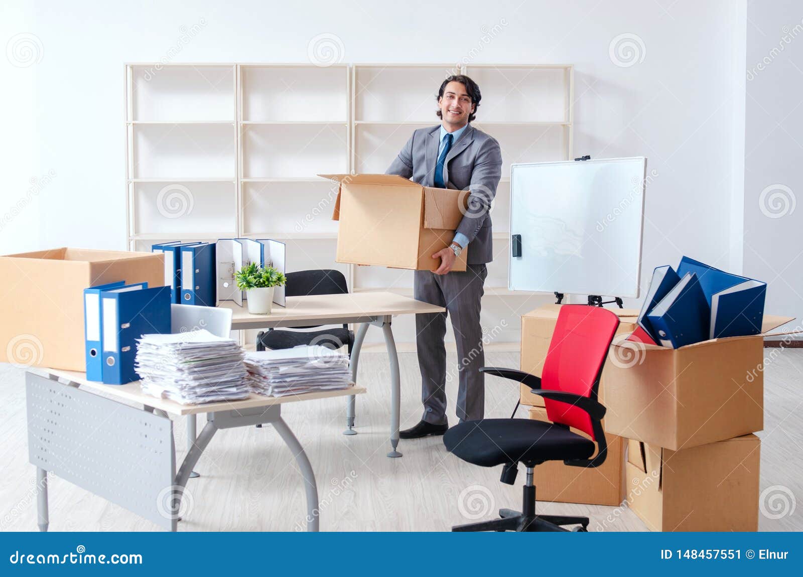 The Young Man Employee with Boxes in the Office Stock Image - Image of ...