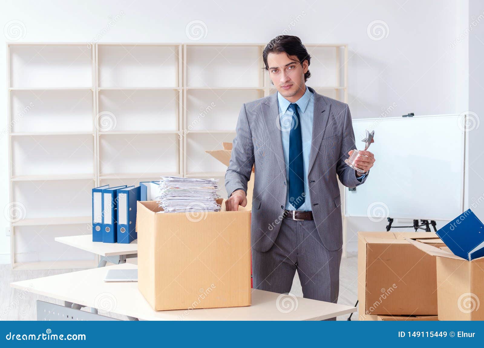 The Young Man Employee with Boxes in the Office Stock Image - Image of ...
