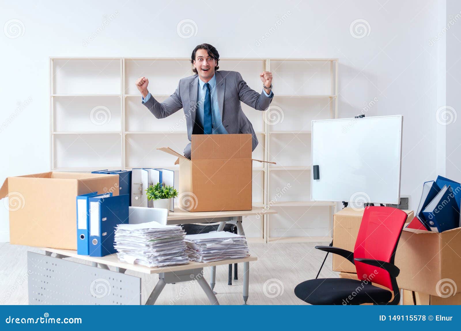 The Young Man Employee with Boxes in the Office Stock Photo - Image of ...
