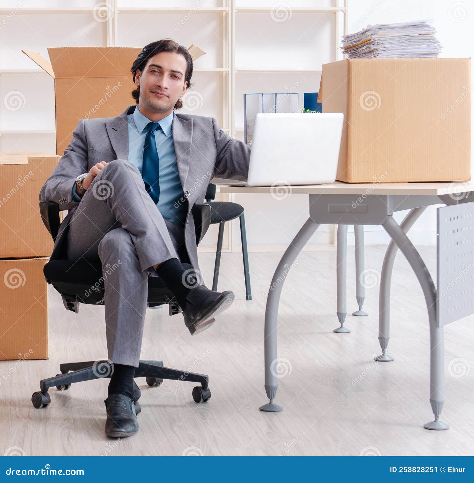 Young Man Employee with Boxes in the Office Stock Image - Image of ...