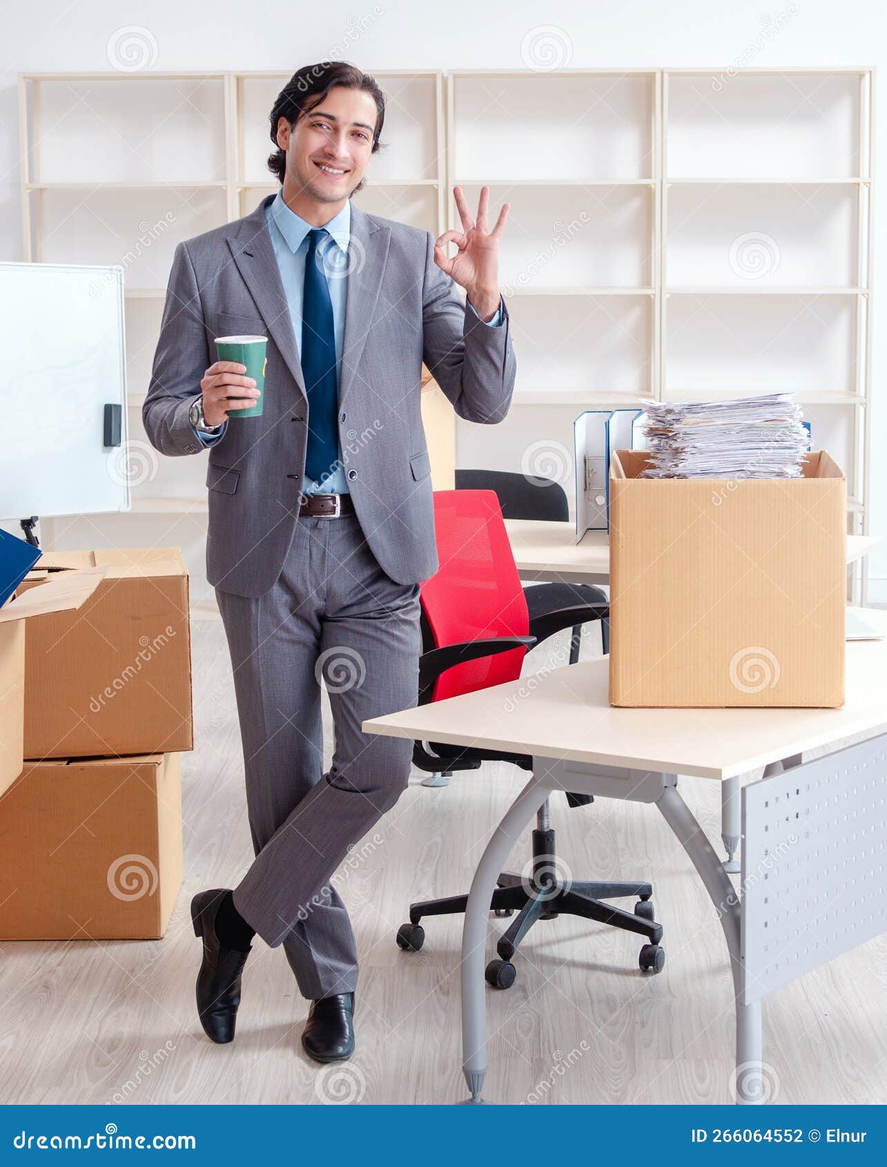 Young Man Employee with Boxes in the Office Stock Photo - Image of ...
