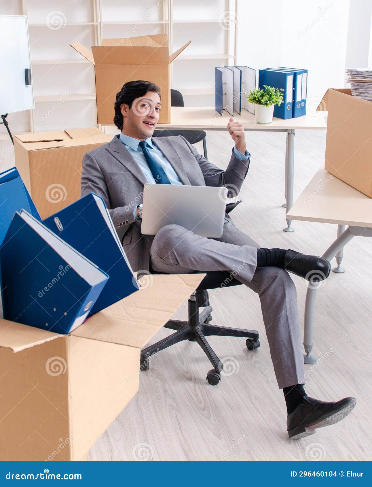 Young Man Employee with Boxes in the Office Stock Photo - Image of ...