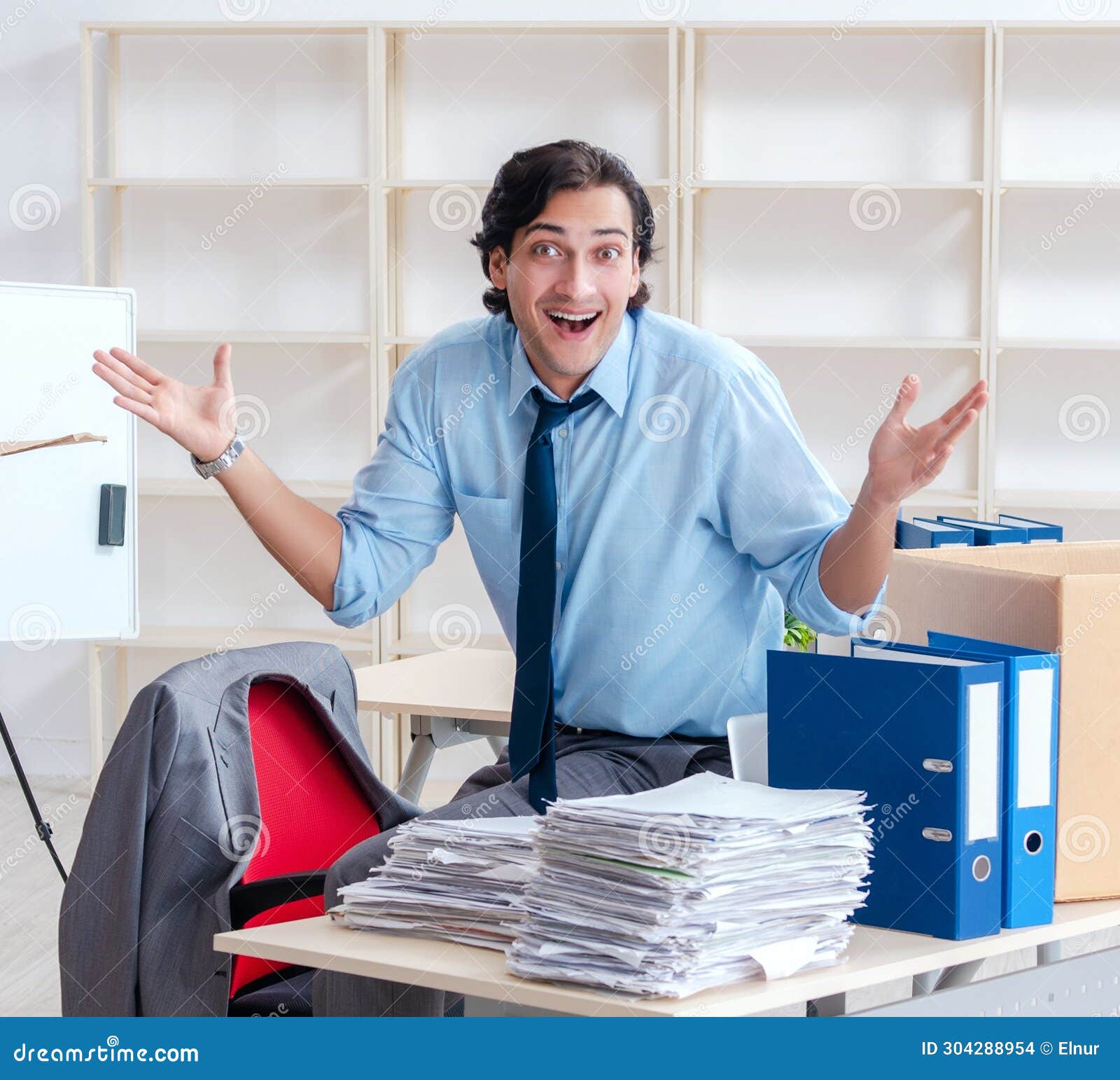 Young Man Employee with Boxes in the Office Stock Photo - Image of ...