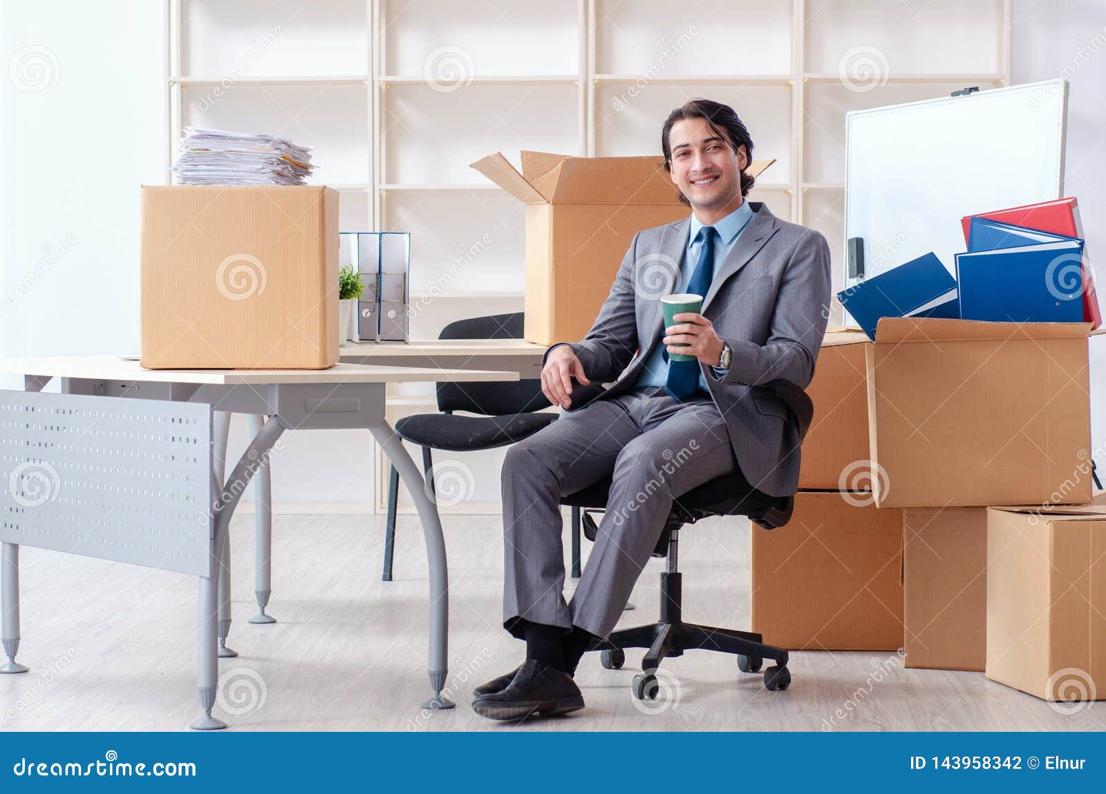 The Young Man Employee with Boxes in the Office Stock Photo - Image of ...