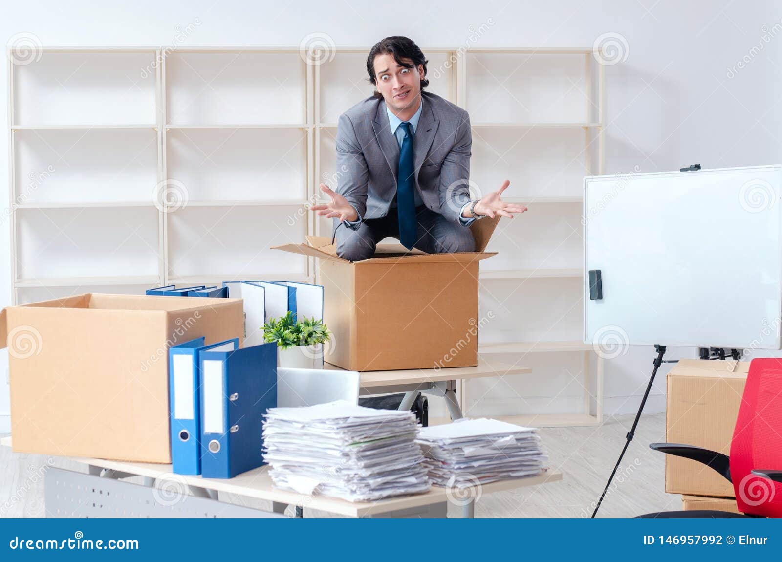 The Young Man Employee with Boxes in the Office Stock Photo - Image of ...