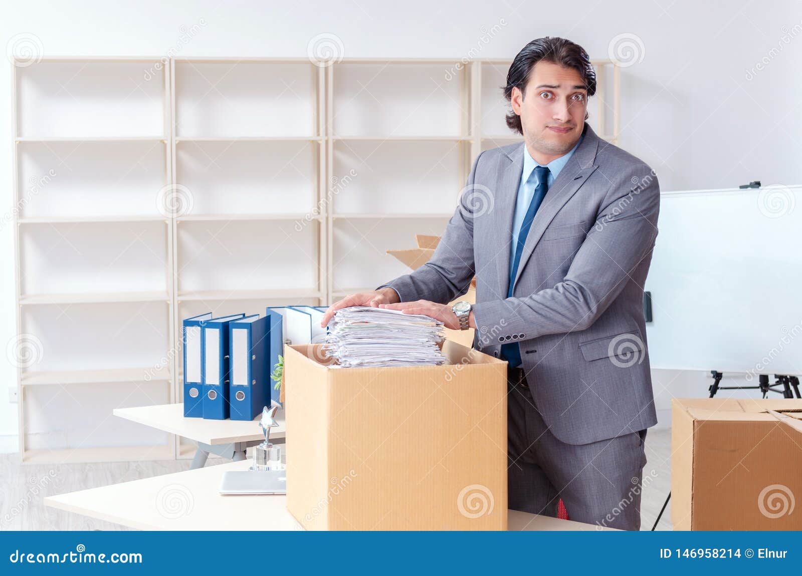 The Young Man Employee with Boxes in the Office Stock Photo - Image of ...