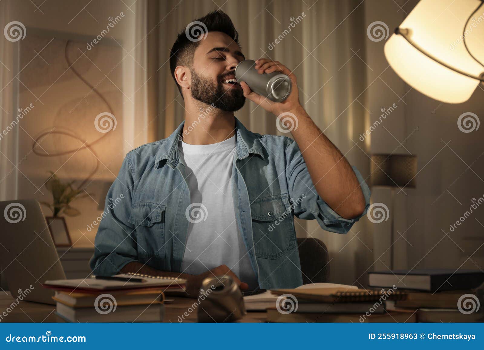 Young Man with Energy Drink Studying at Home Stock Image - Image of ...