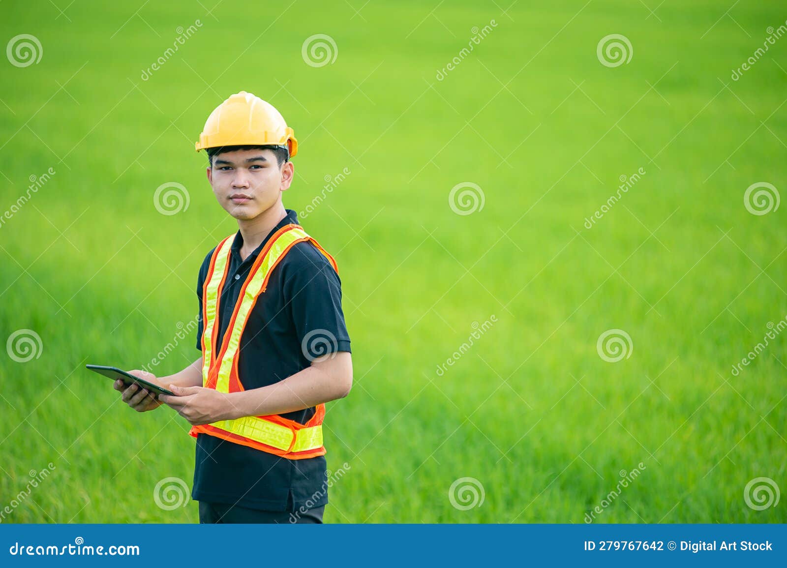 A Young Man Engineer with Green Rice Fields Background. Asian Worker ...