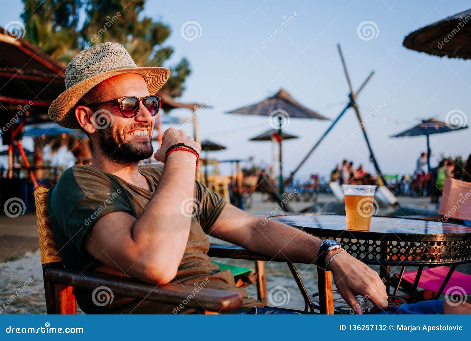 Young Man Enjoying Beer in a Beach Bar Stock Photo - Image of drink ...
