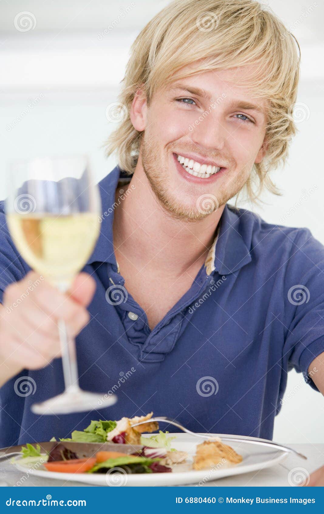 Young Man Enjoying Meal stock photo. Image of clothing - 6880460